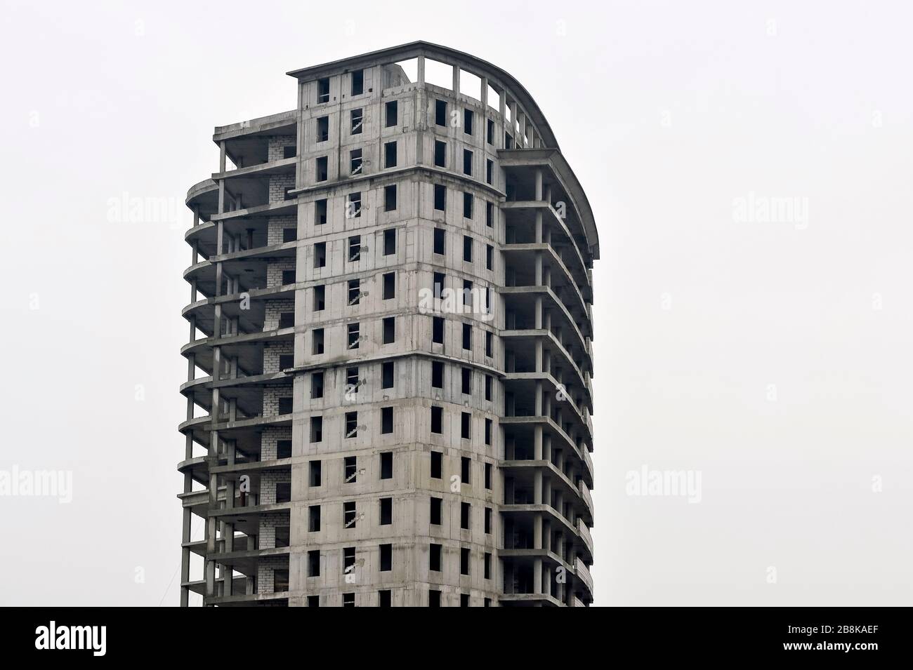 Concrete gray high-rise building partially without external walls ...