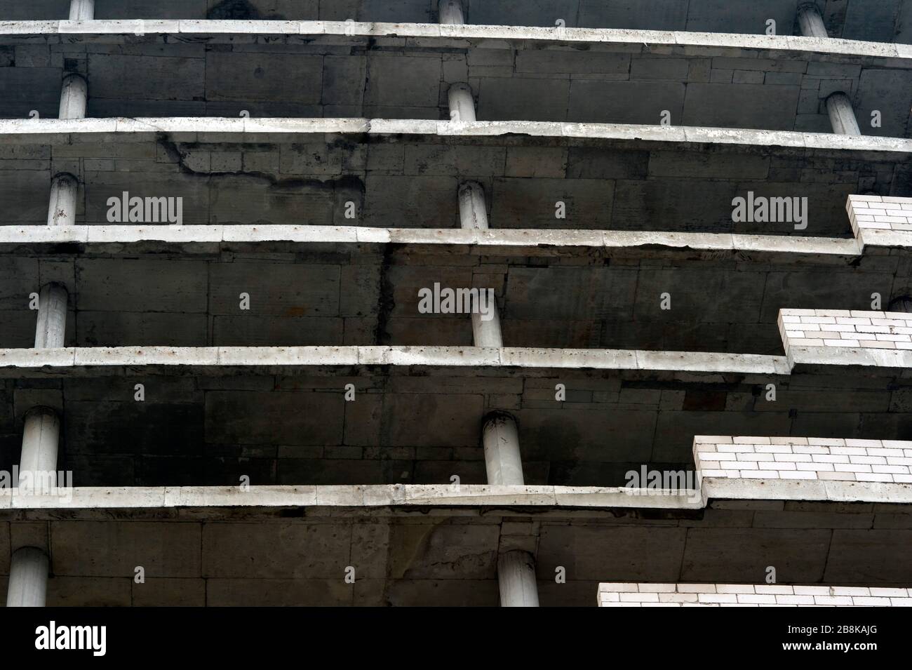 Floors of a large gray concrete building without external walls ...