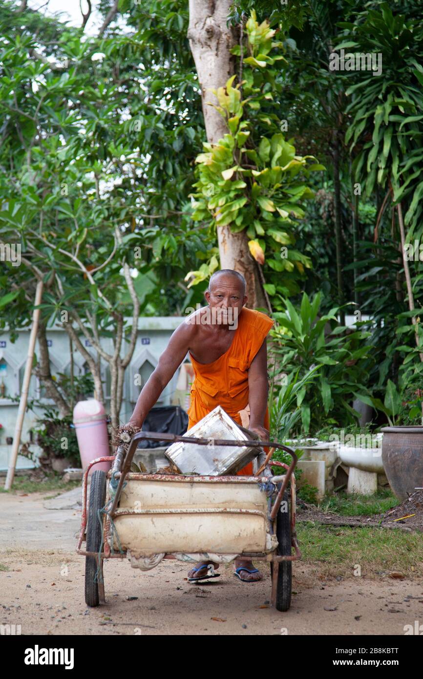 Buddhist monk sweeping leaves hi-res stock photography and images - Alamy
