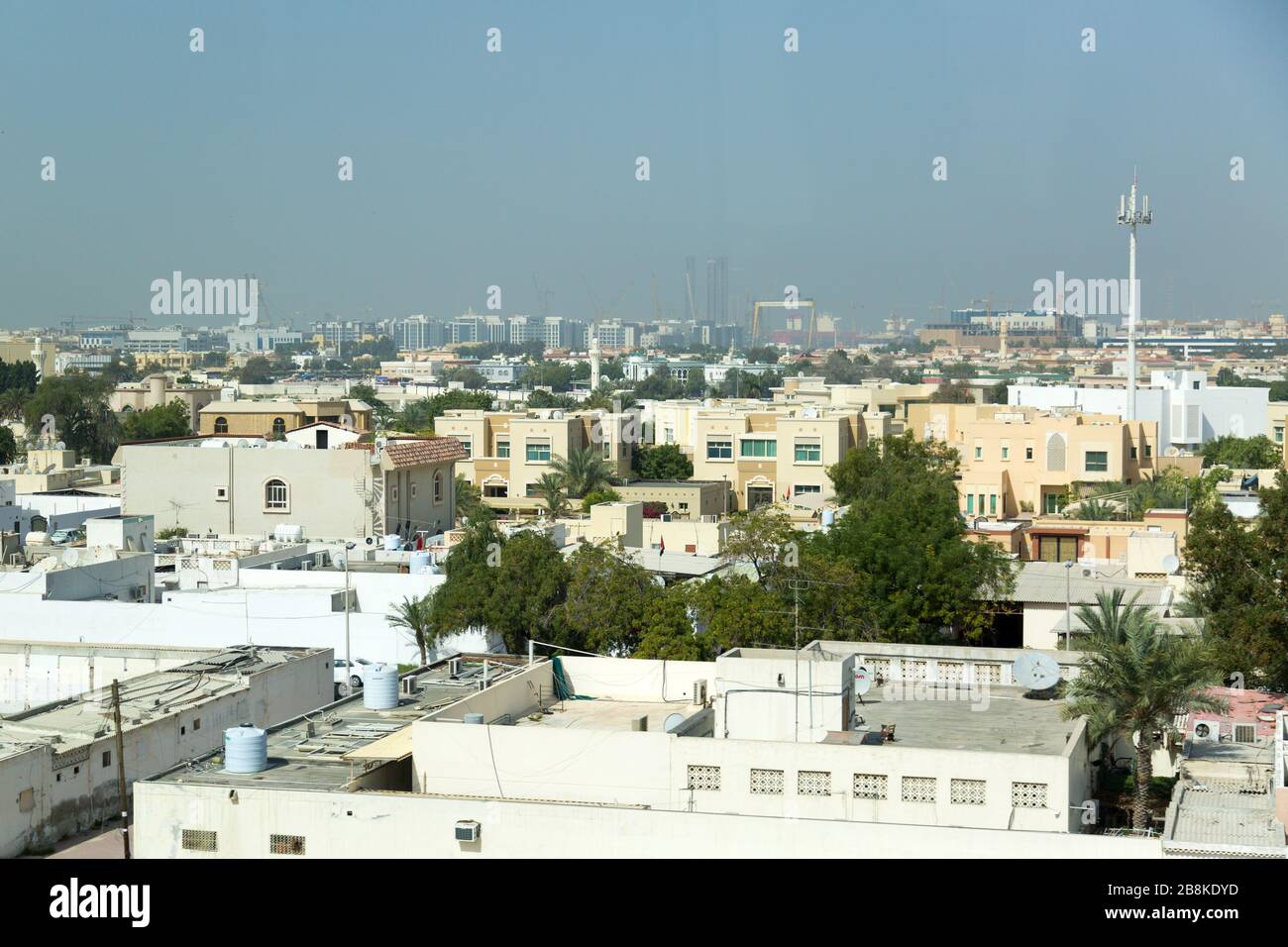 The small old houses and buildings of Dubai against the backdrop of new ...