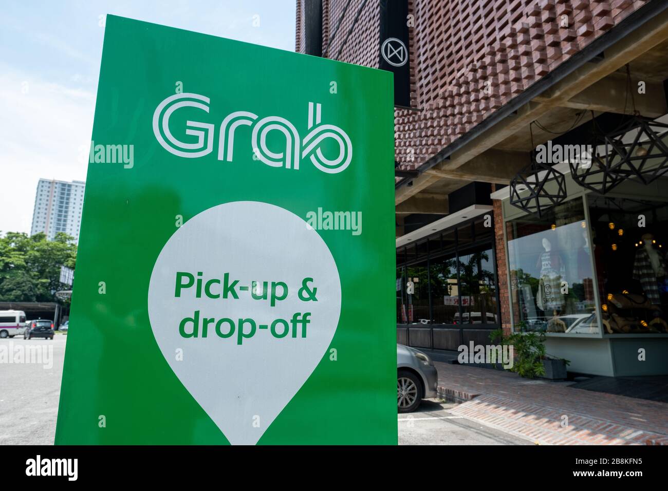 'Grab' pick up and drop off point sign- a Singapore based a ride ...