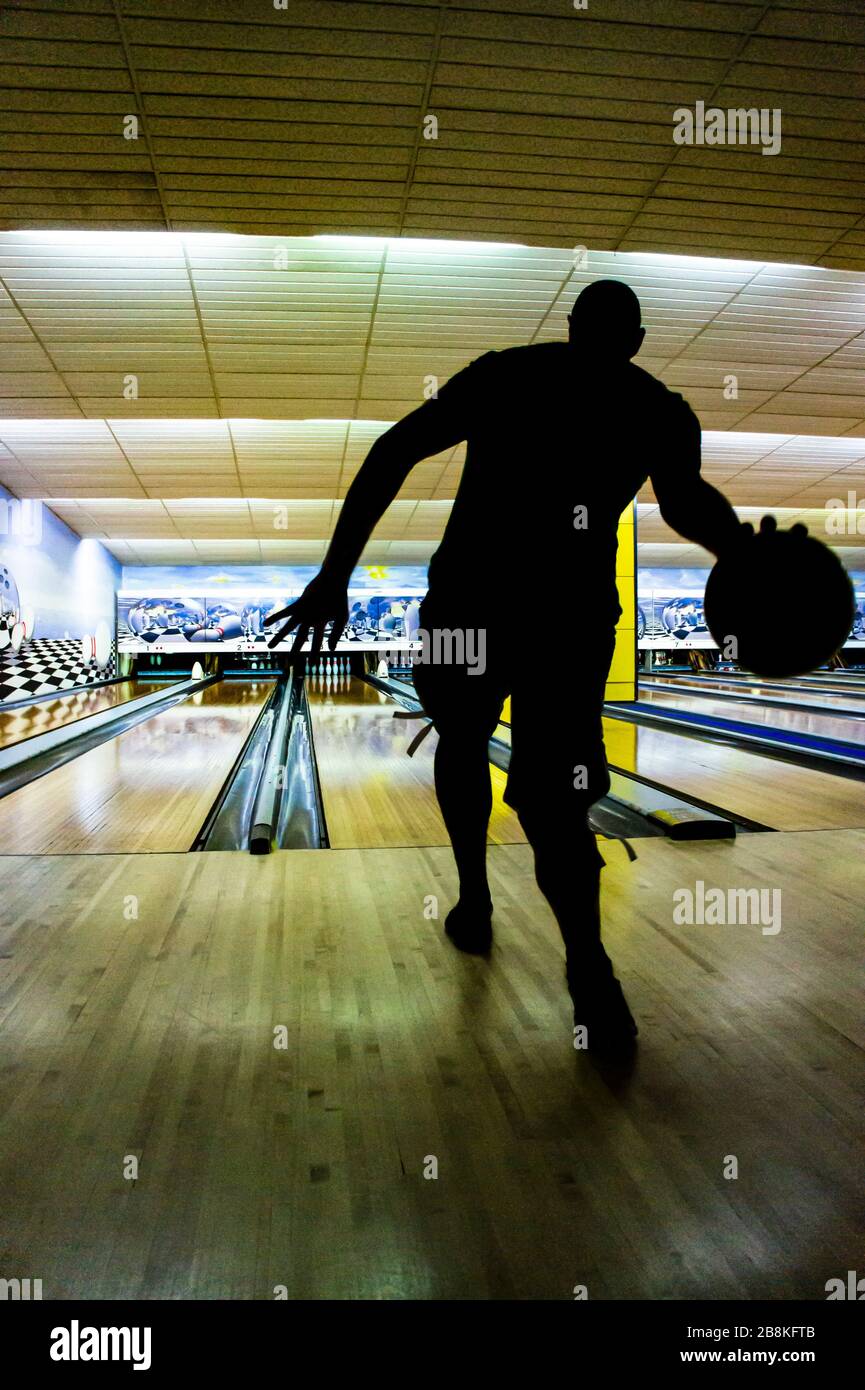 Silhouette of a bowling player Stock Photo - Alamy