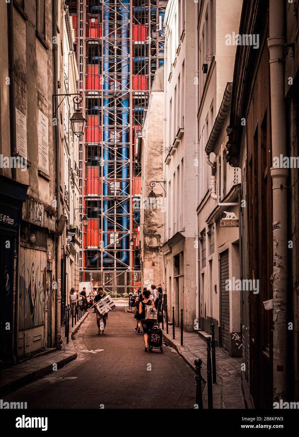 The contrast of a traditional Parisian back street with the post-modern ...