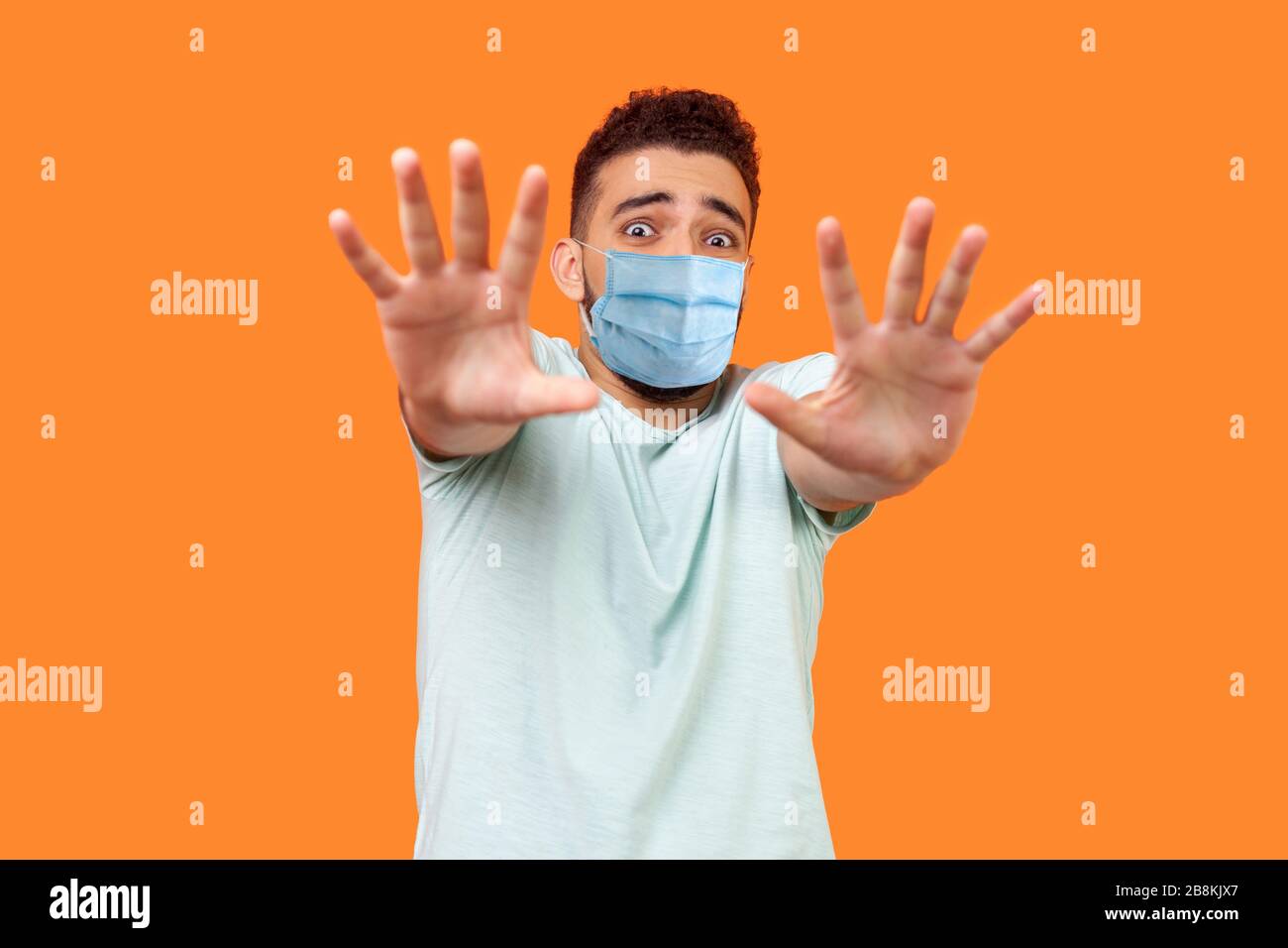 I'm afraid! Portrait of scared terrified man with medical mask in white ...