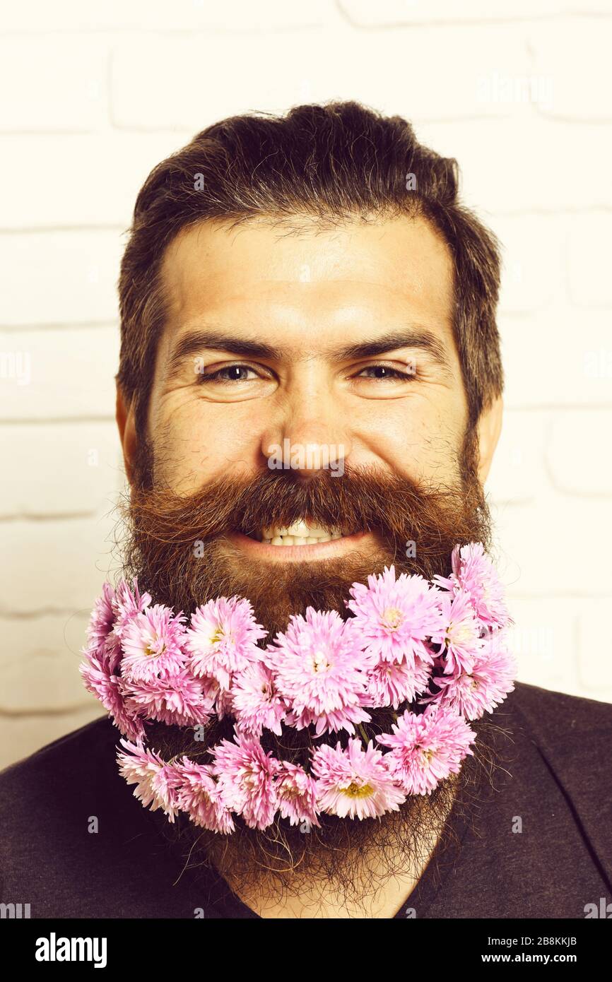 handsome bearded man with stylish mustache and shirt with pink autumn ...