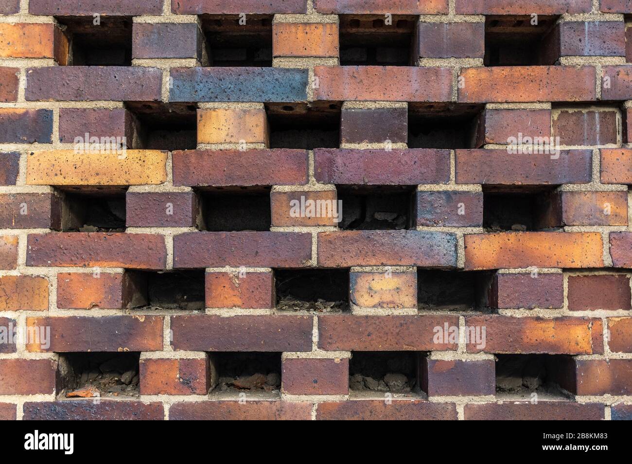Building wall made of dark, yellow to brownish clinker bricks with ...