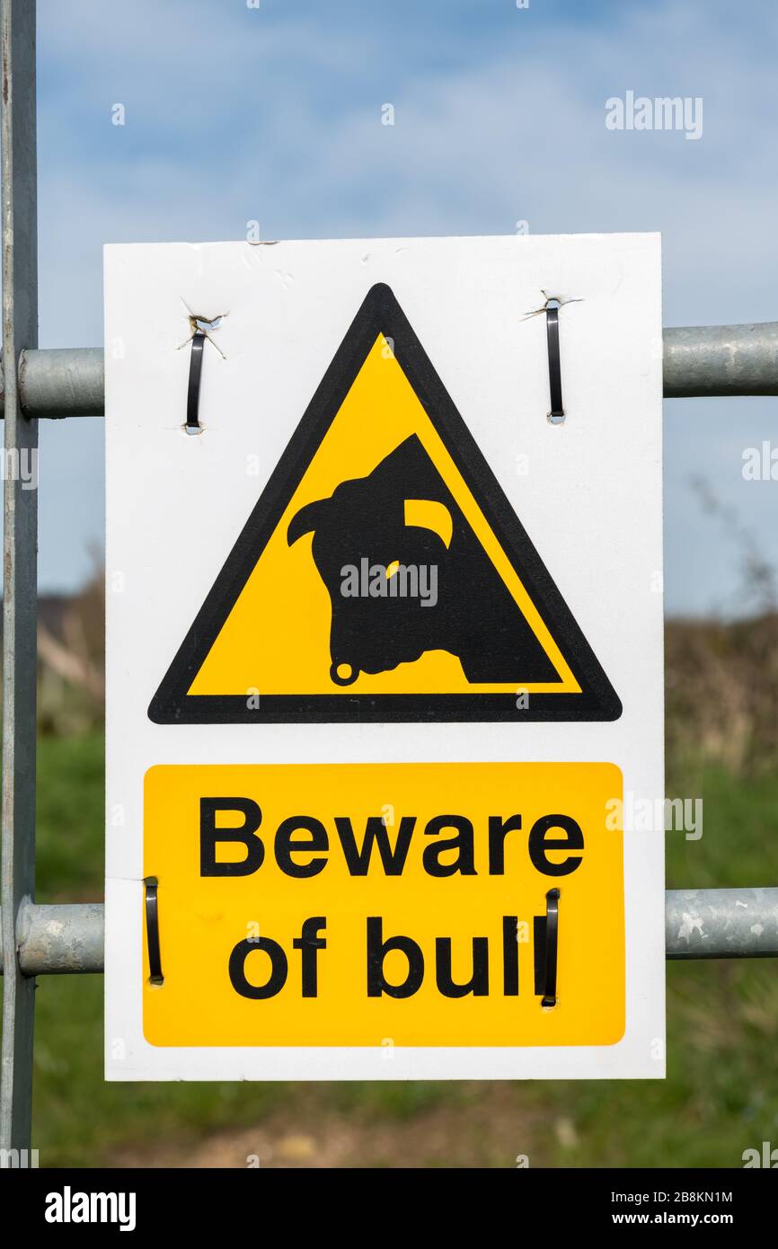 Beware of Bull sign post Stock Photo - Alamy