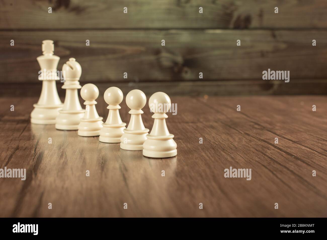White chess figures in a row Stock Photo - Alamy