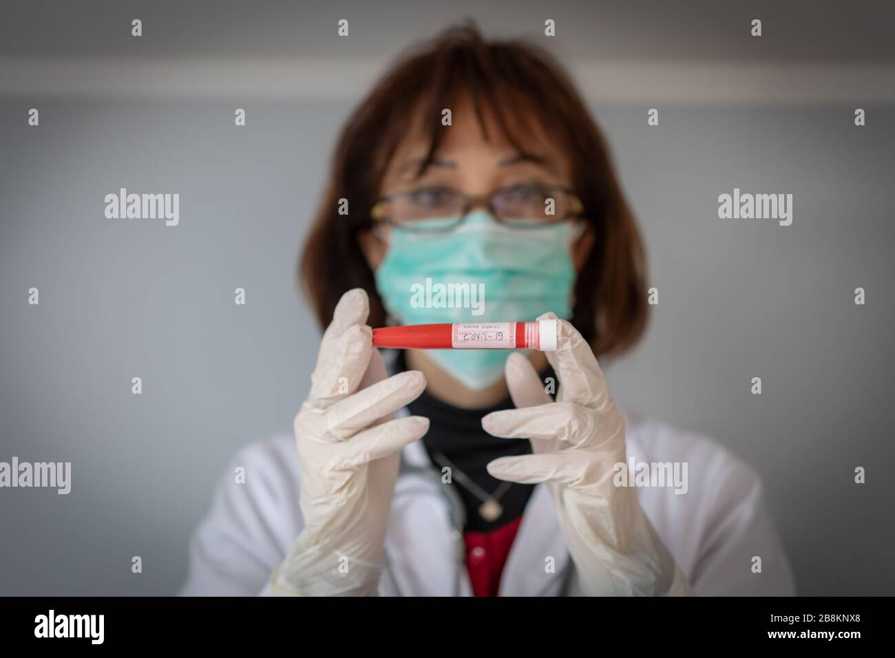 Italian female doctor works on Coronavirus after a positive patient ...