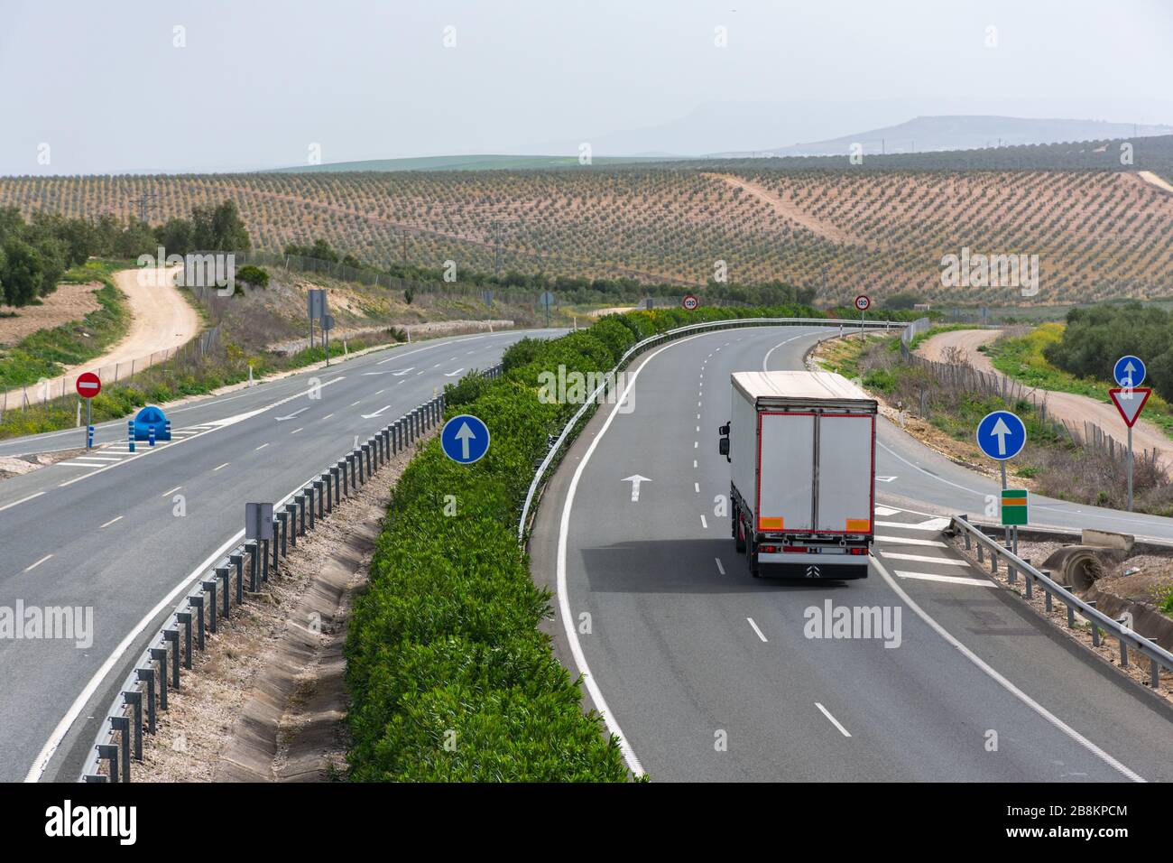 Articulated general cargo truck driving on the highway Stock Photo - Alamy
