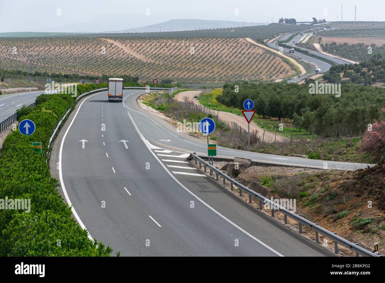 Articulated general cargo truck driving on the highway Stock Photo - Alamy