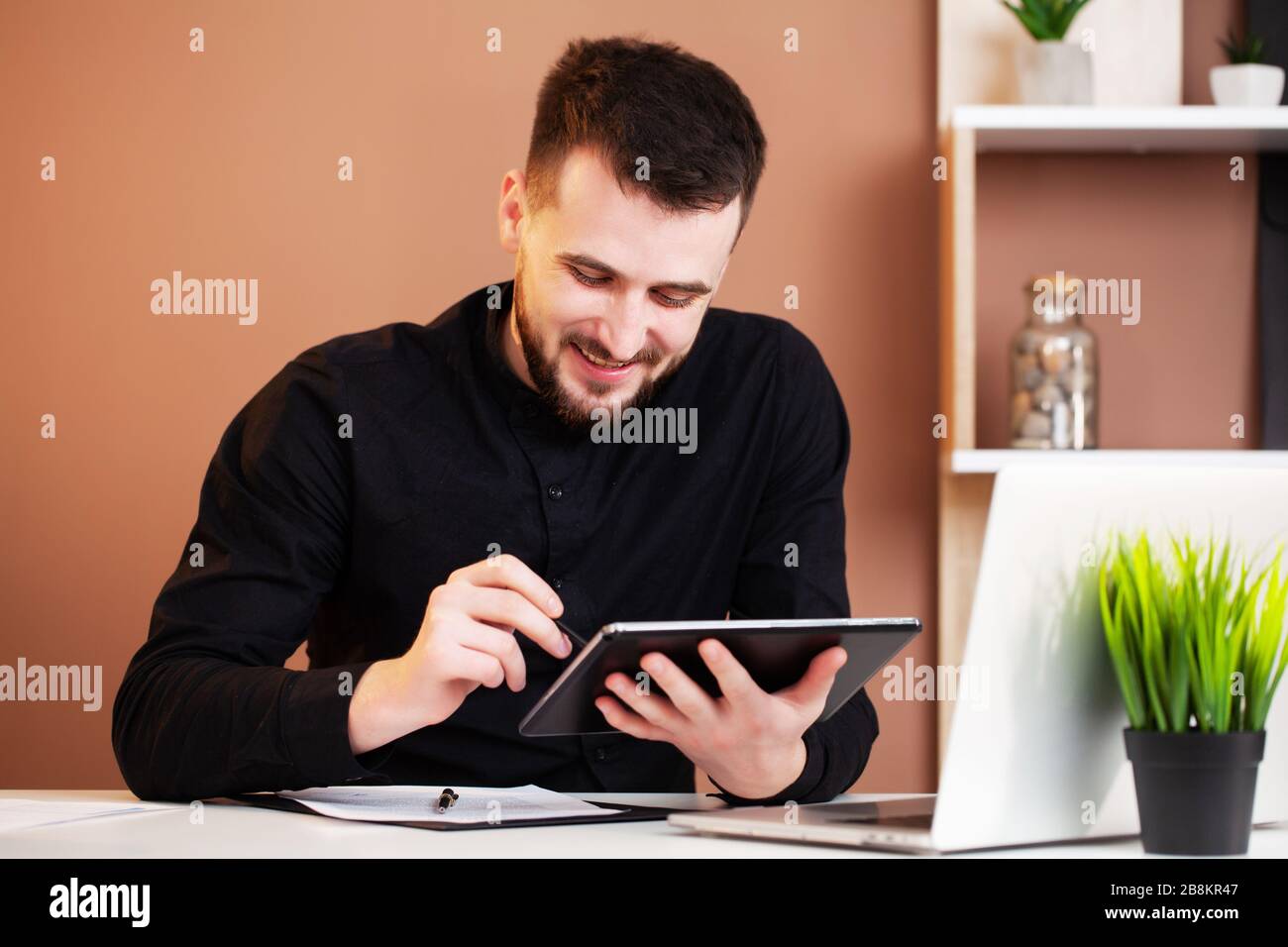 Employee works at the computer in office Stock Photo - Alamy