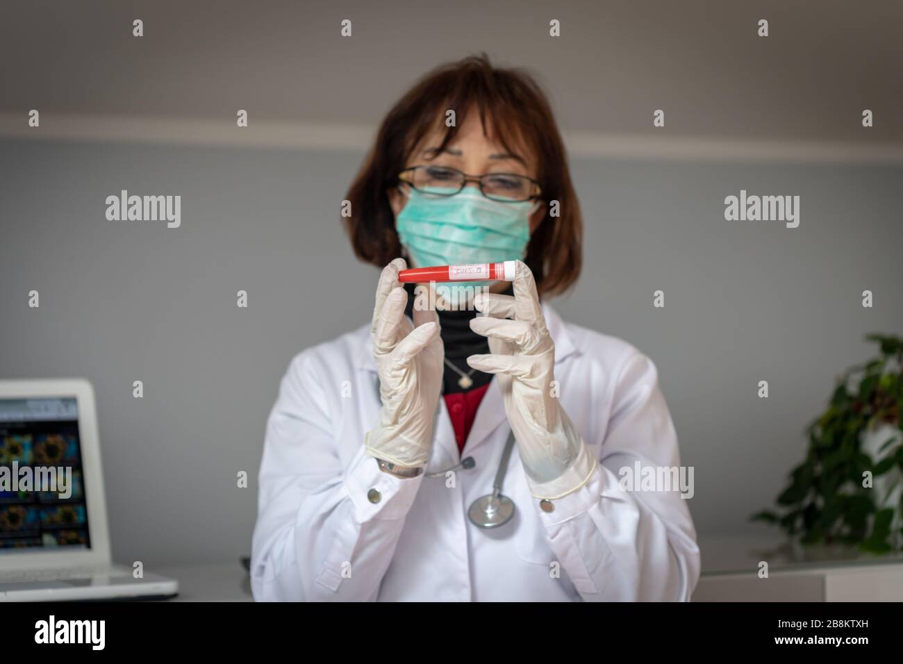 Italian female doctor works on Coronavirus after a positive patient ...