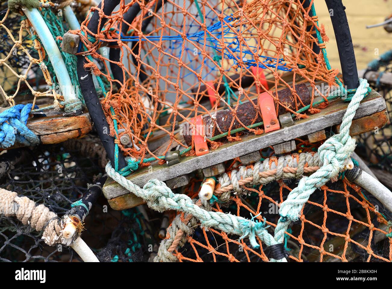Nylon lobster pots stacked up Stock Photo - Alamy