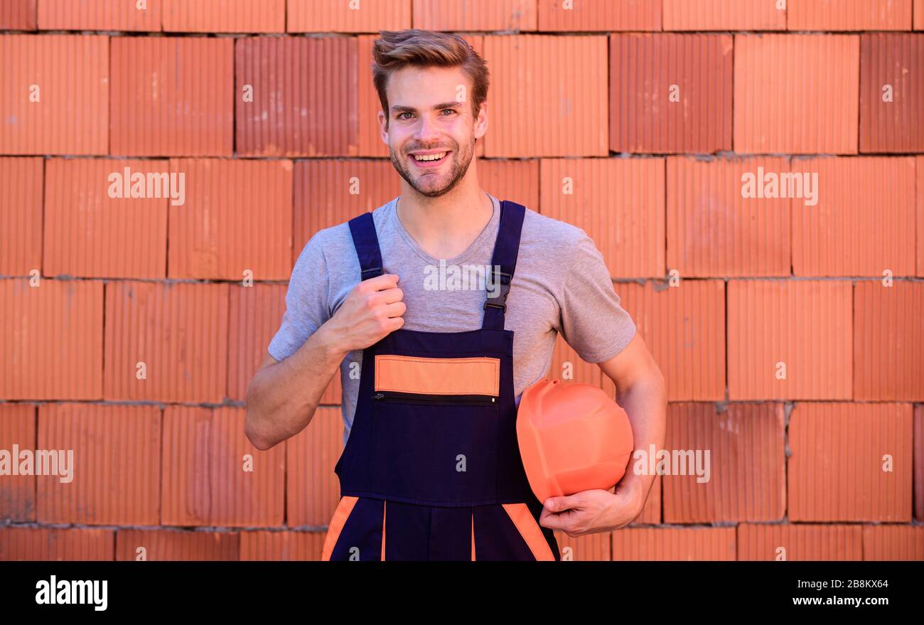 Building construction. Man build house. Inspecting building. Worker ...