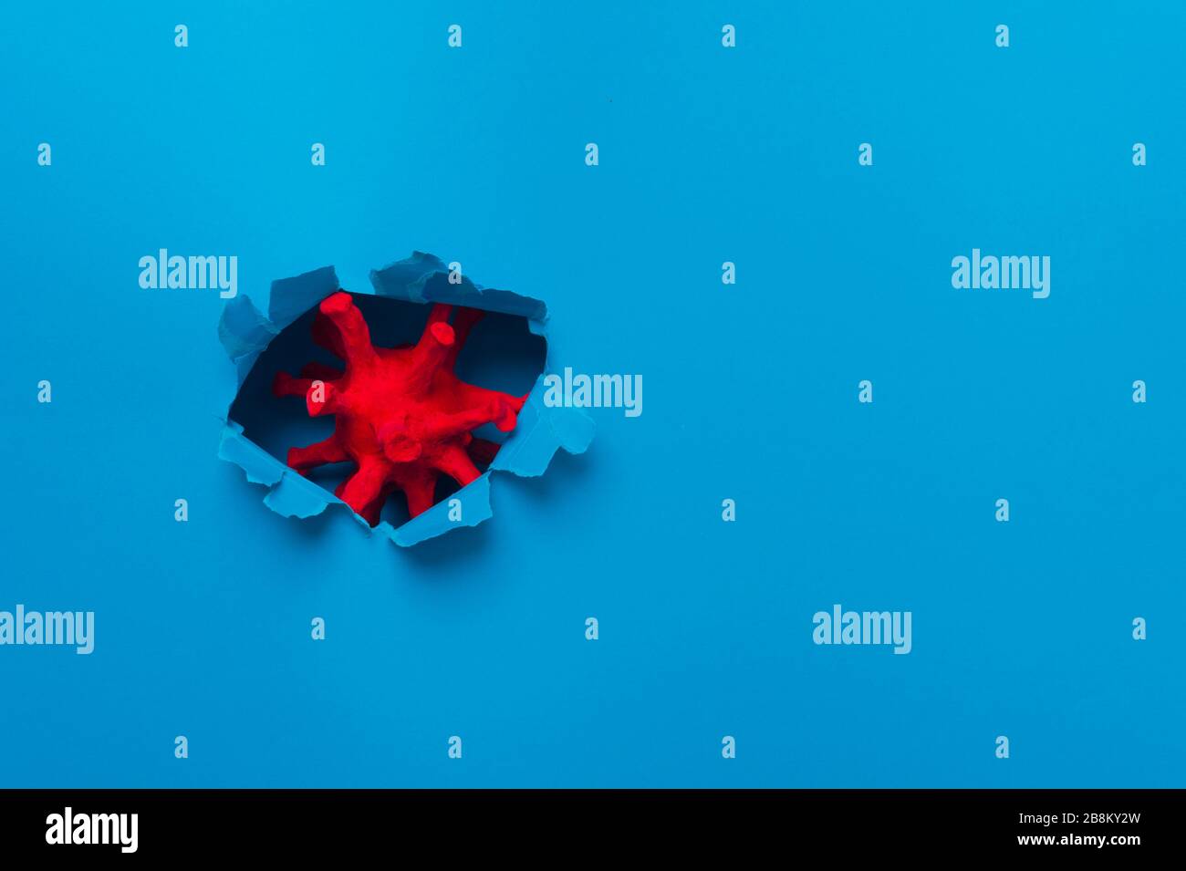 Abstract Red Virus Strain Model in paper cut hole. Corona virus ...
