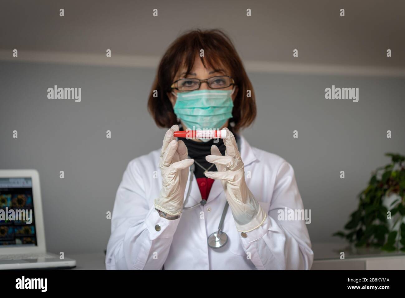 Italian female doctor works on Coronavirus after a positive patient ...