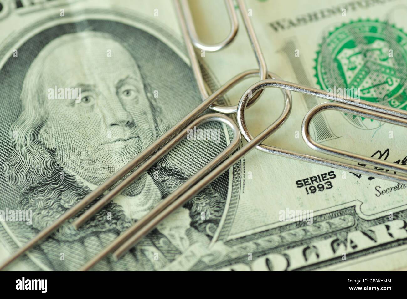 Dollar banknote with three joined paper clips - Concept of union and ...