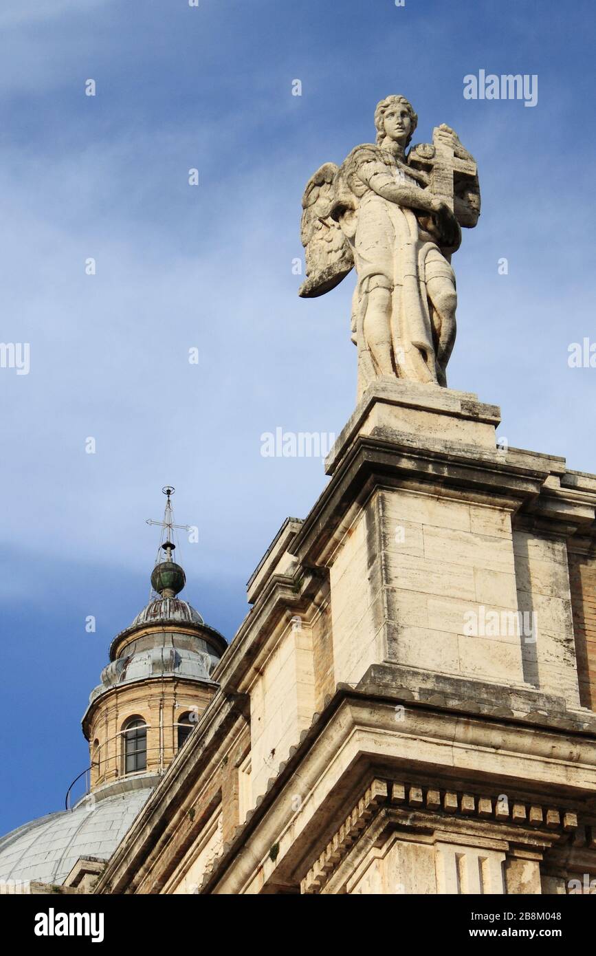 Angel statue in the facade of St. Mary of Angels Basilica in Assisi ...
