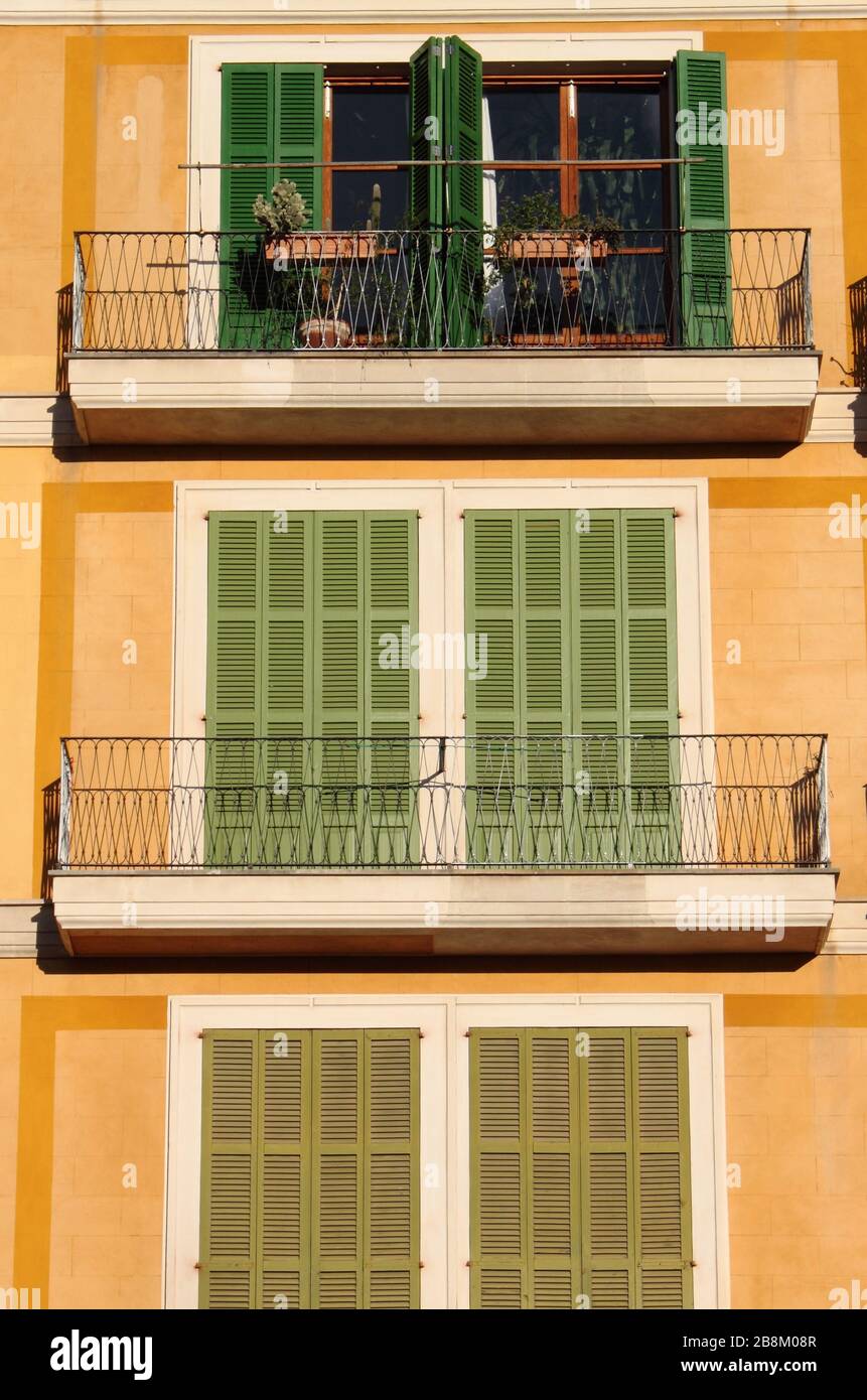 Squared windows with closed shutters and balconies Stock Photo - Alamy
