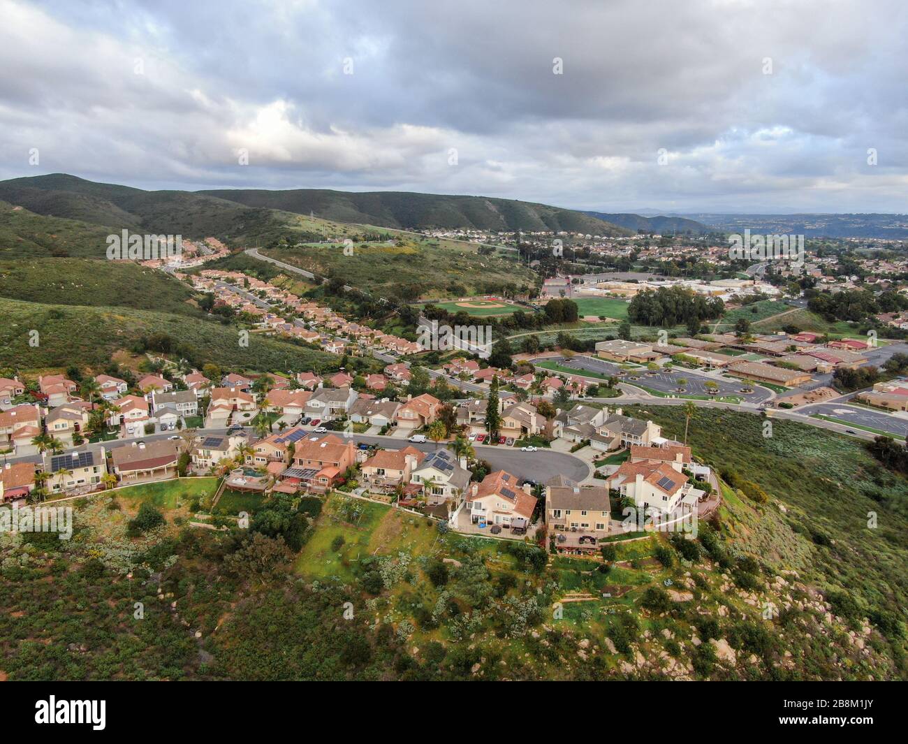 Aerial view of upper middle class neighborhood with residential ...