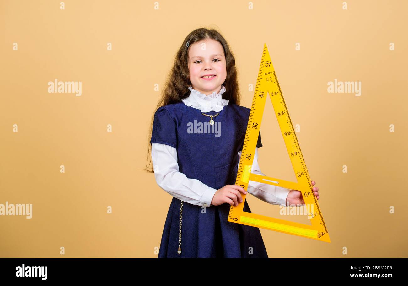 Kid school uniform hold ruler. I love mathematics. Education and school ...