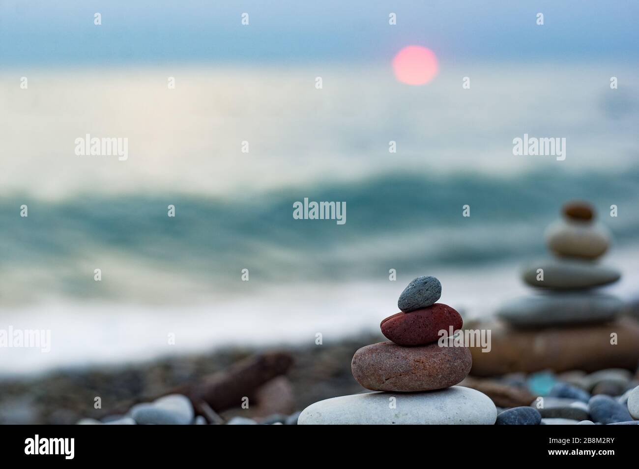 stack of zen stones on pebble beach Stock Photo - Alamy