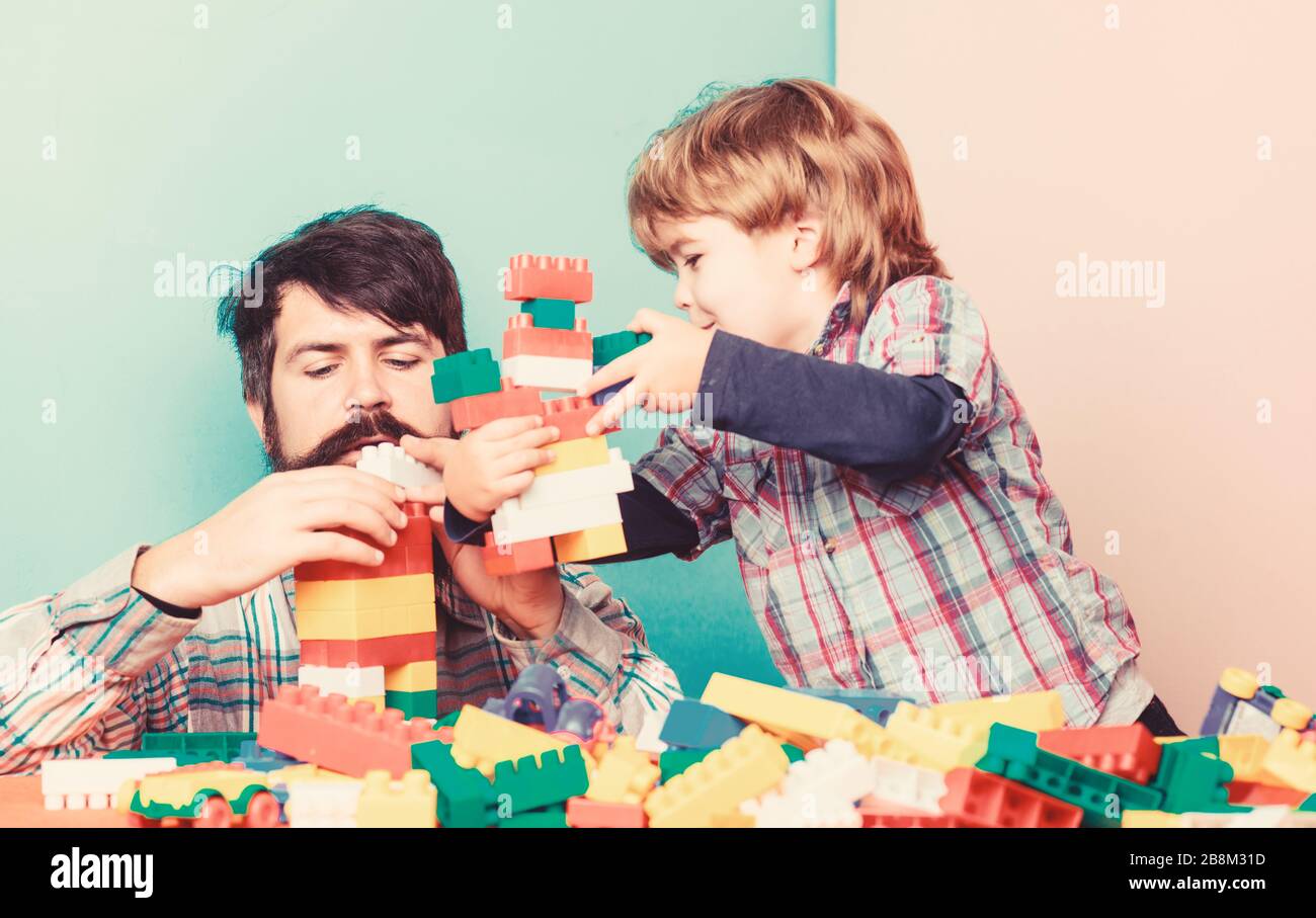 Importance of playing together. Dad and son have fun. Childish cheerful ...