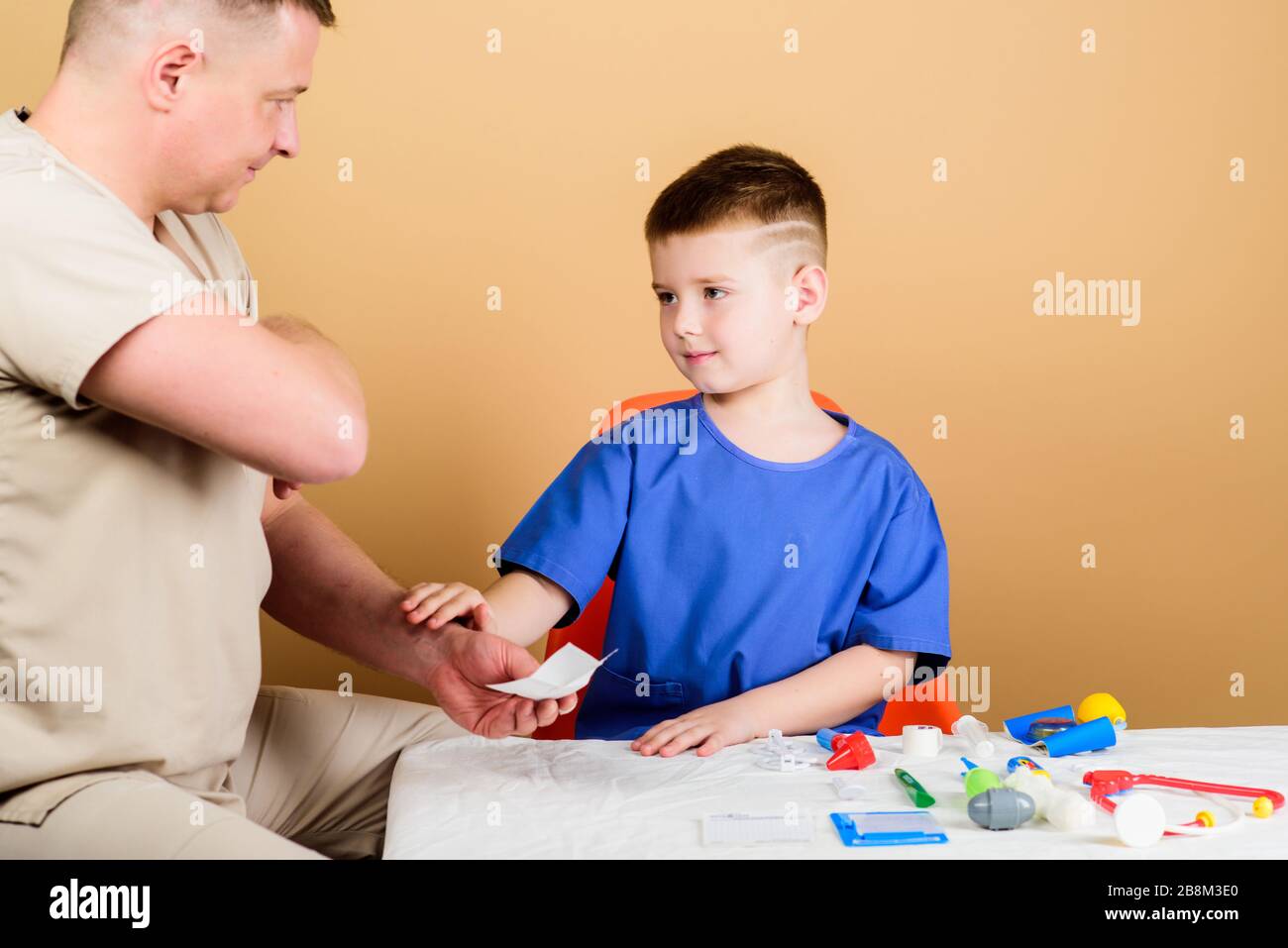 Health care. Medical examination. Boy cute child and his father doctor ...