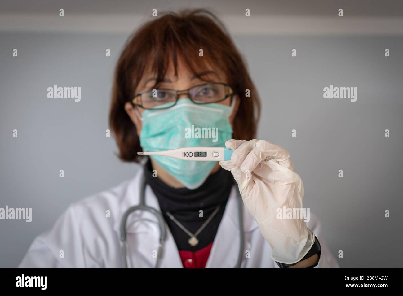 Italian female doctor works on Coronavirus after a positive patient ...