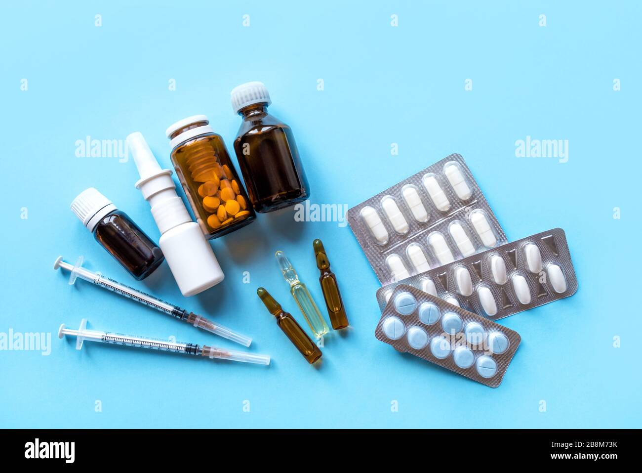 Tablets, pack of medicines with medicine bottles on a blue background ...