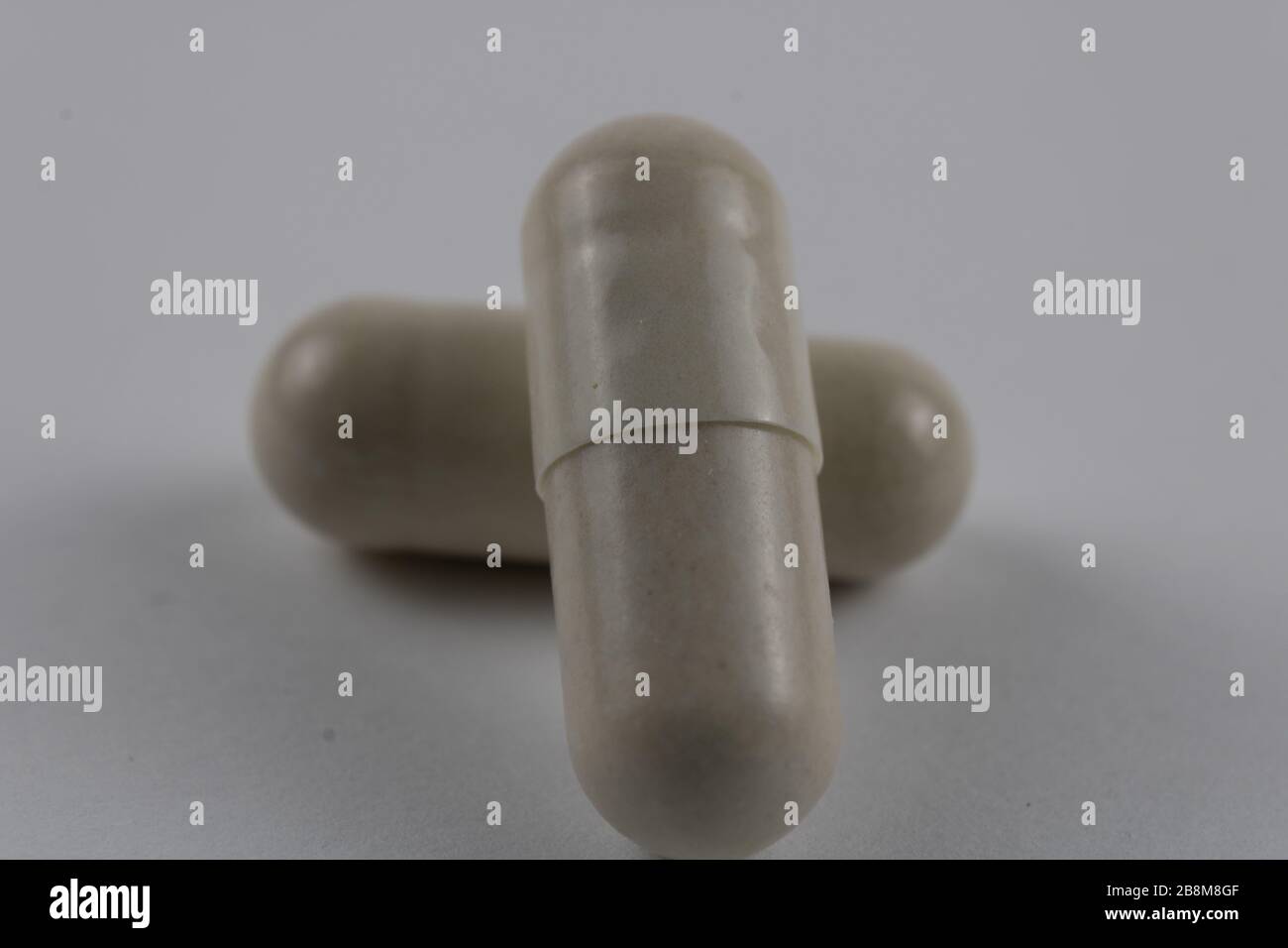 white pill capsule isolated on white background. photography of ...