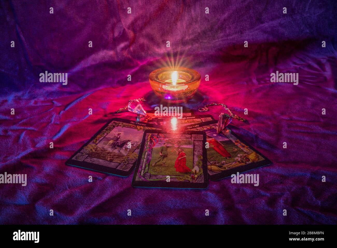 Fortune telling with tarot cards, crystal dowsing pendulums and a tea ...