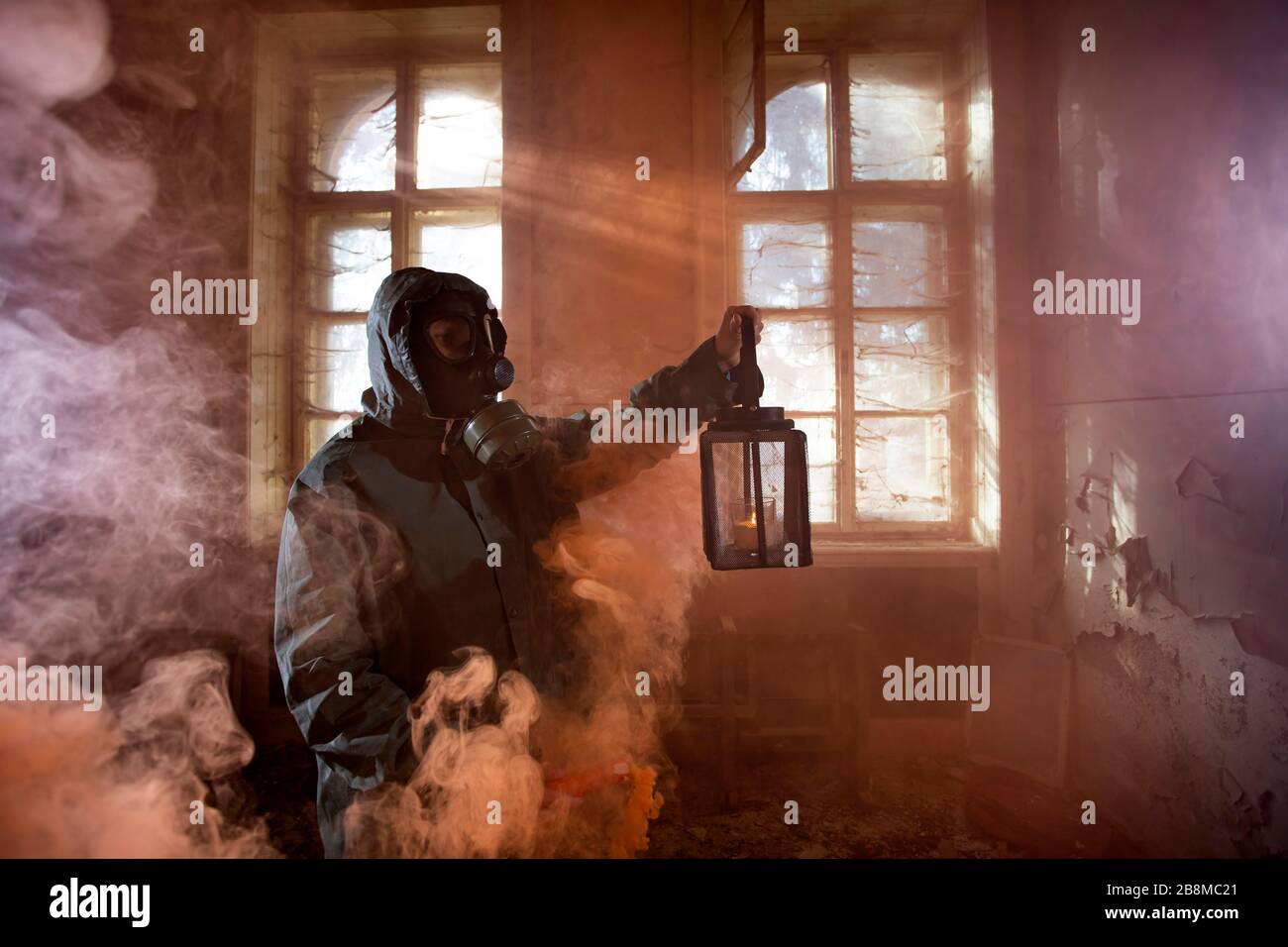 Post apocalyptic survivor in gas mask in the smoke. Environmental ...
