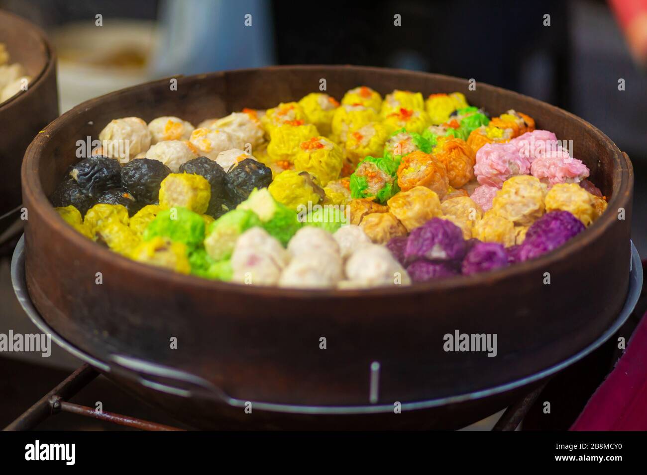 Colorful steamed dim sum, chinese dumpling in a wooden steamer. at ...