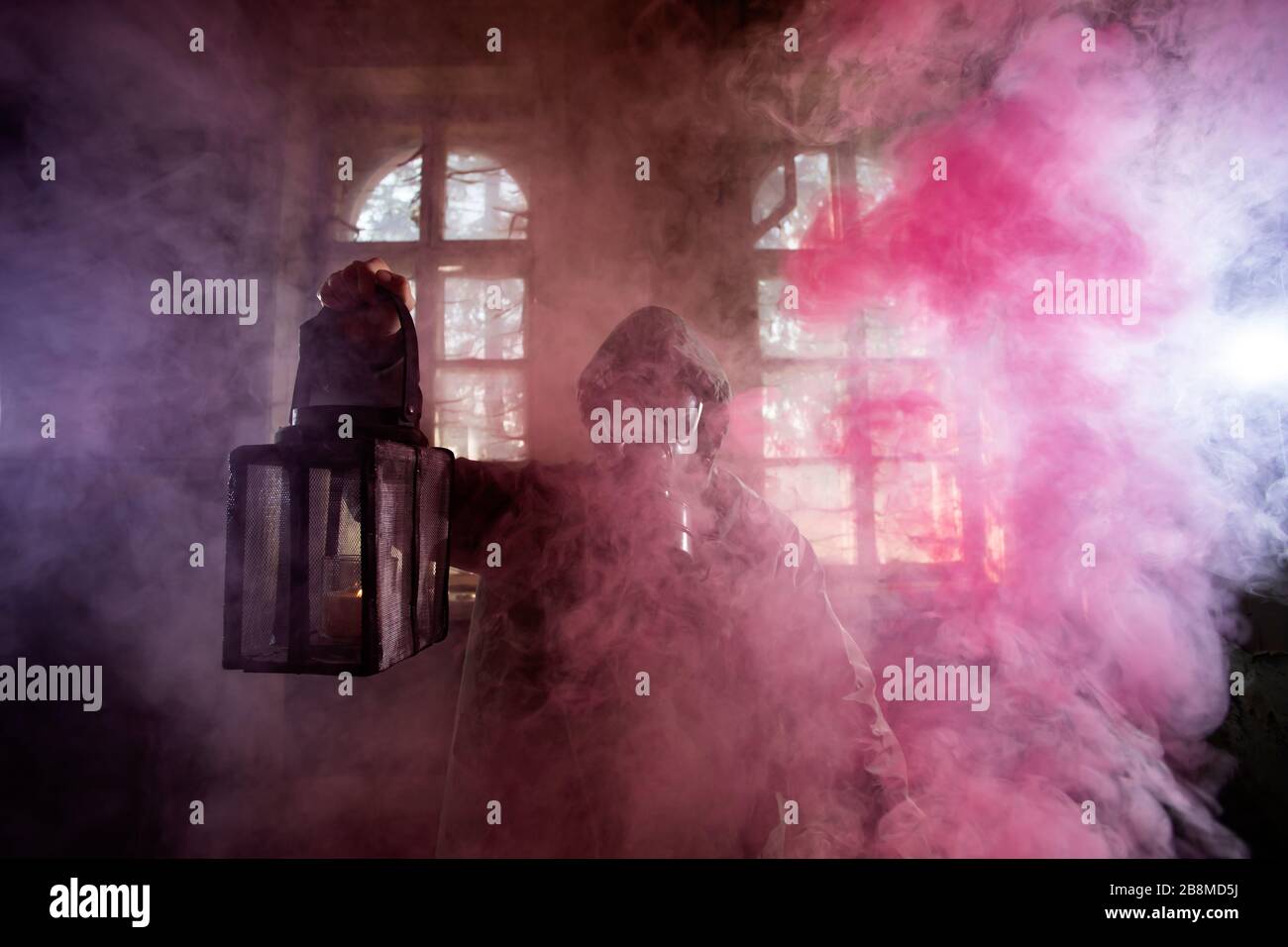 Post apocalyptic survivor in gas mask in the smoke. Environmental ...