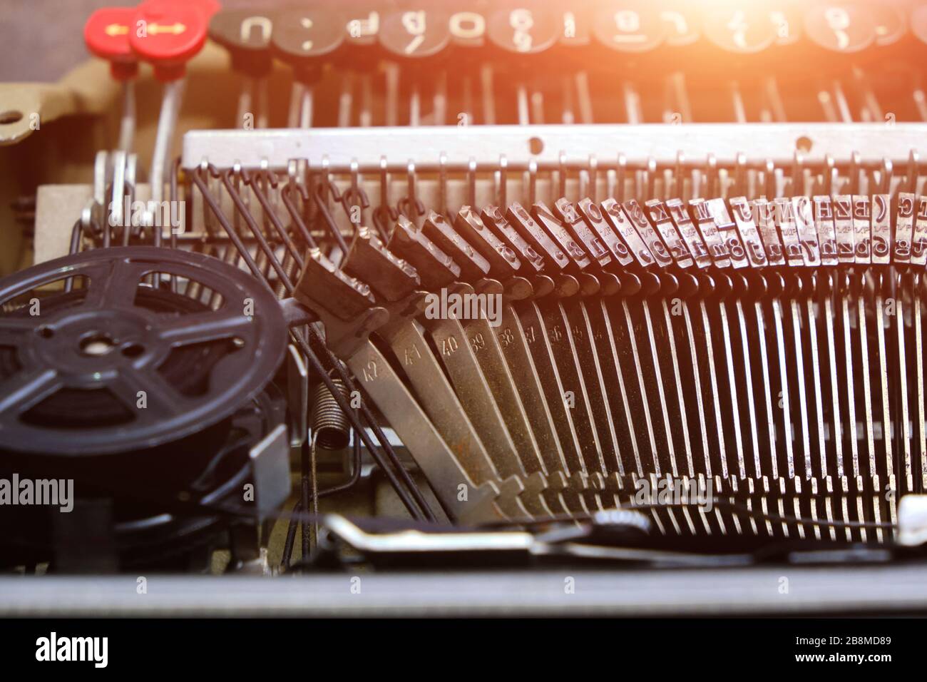Mechanism and keyboard of an old typewriter with a film coil. Bright ...