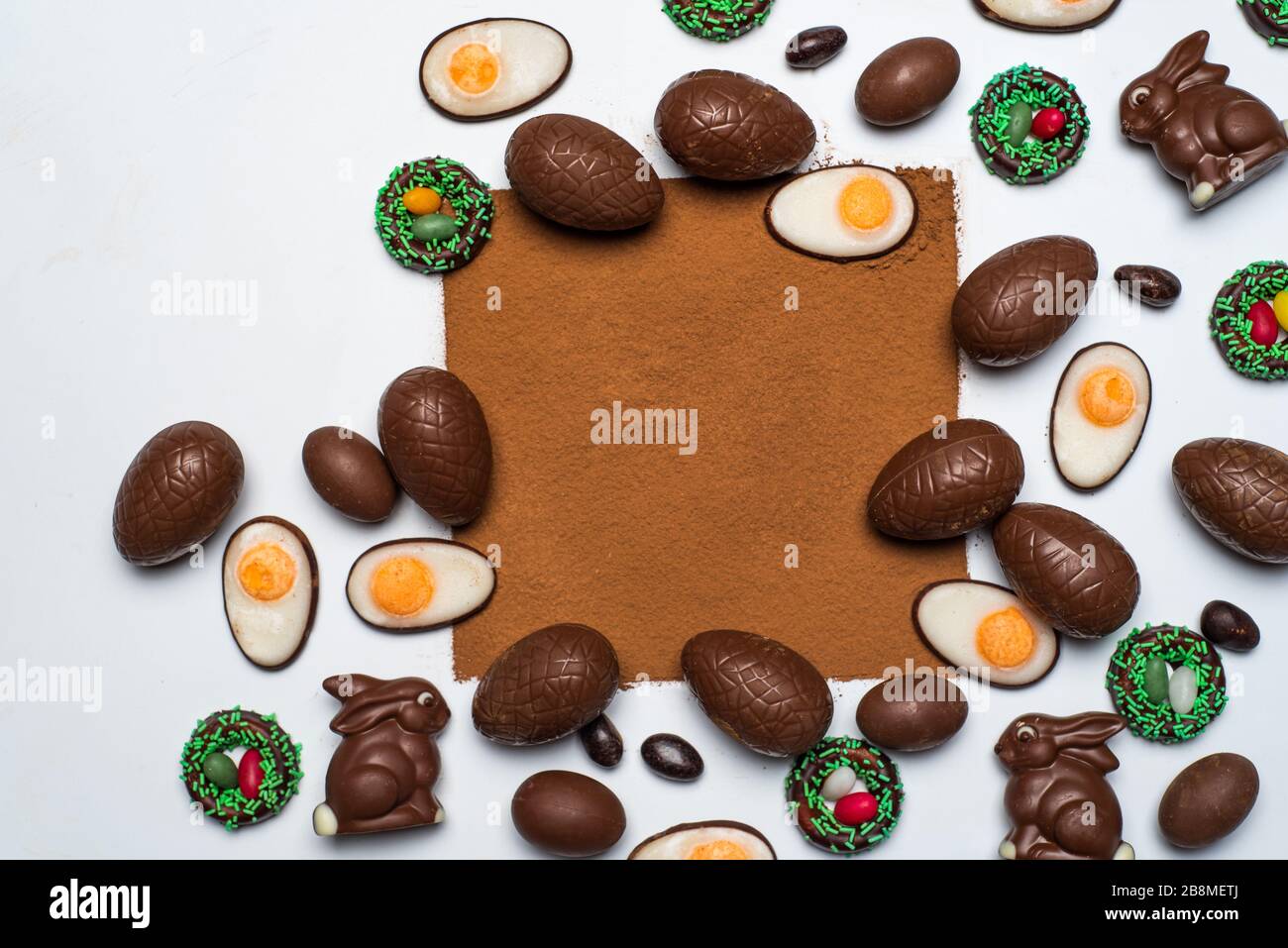 Chocolate Easter eggs and space for text made of cacao powder Stock ...