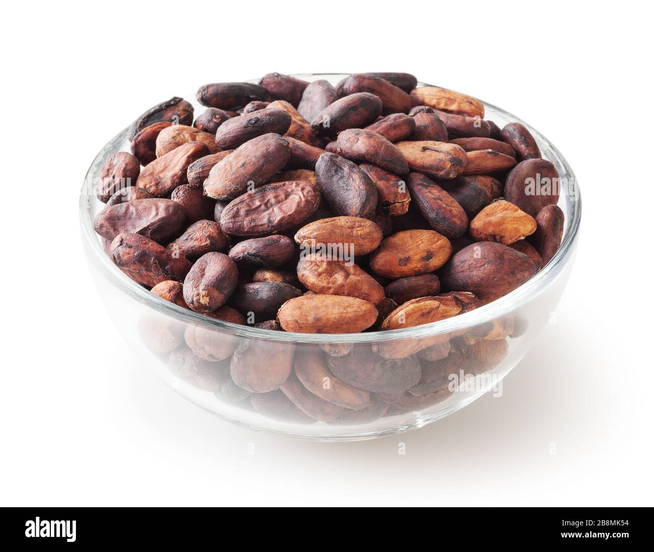 Uncooked cocoa beans in glass bowl isolated on white background with ...