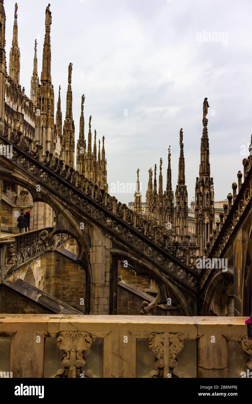 View of Duomo di Milano roof on rainy spring day.It is renowned for the ...