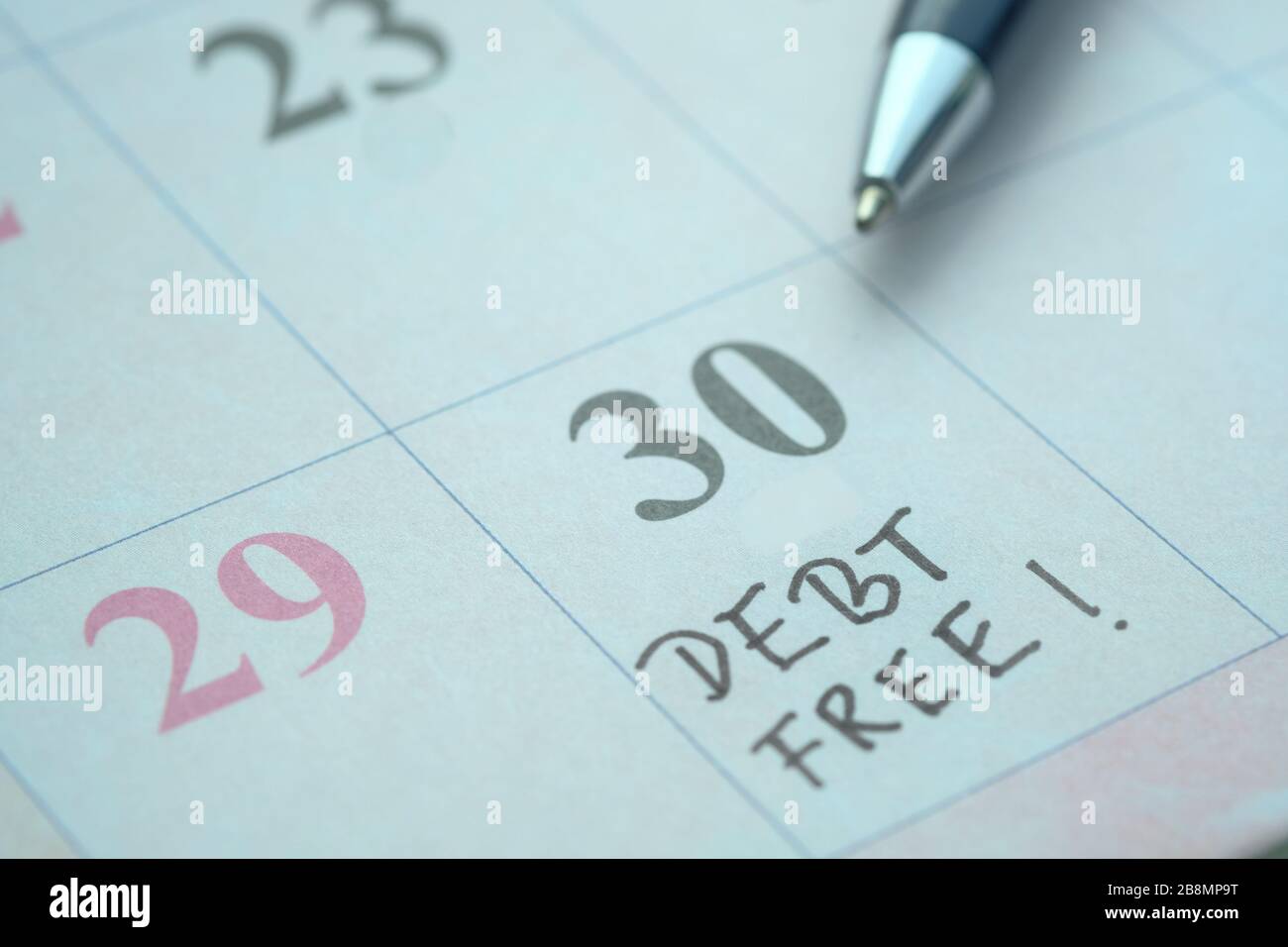 Debt Free word on calendar date, close up Stock Photo - Alamy