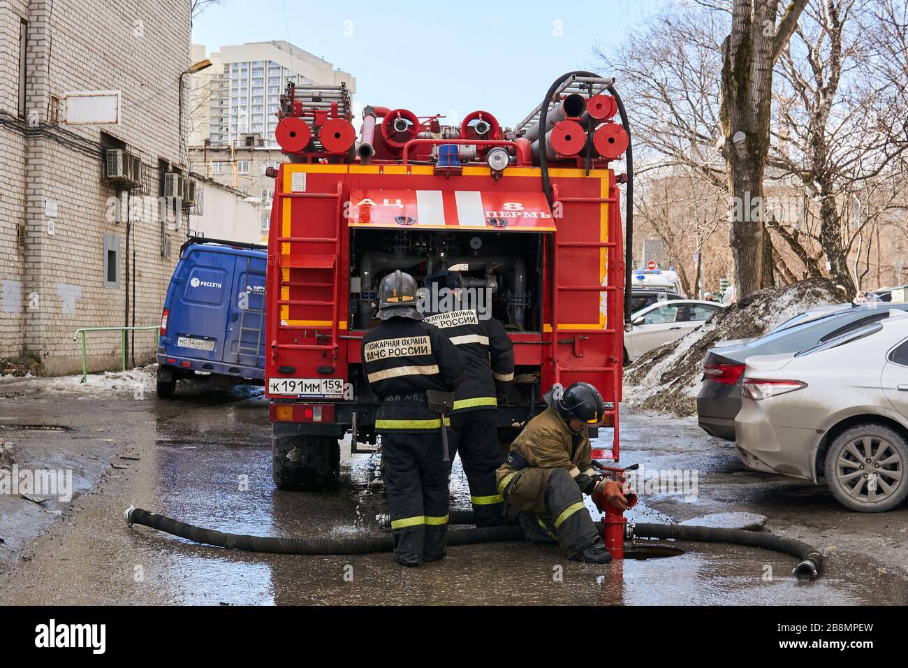 Perm, Russia - March 20, 2020: firefighters use an underground fire ...