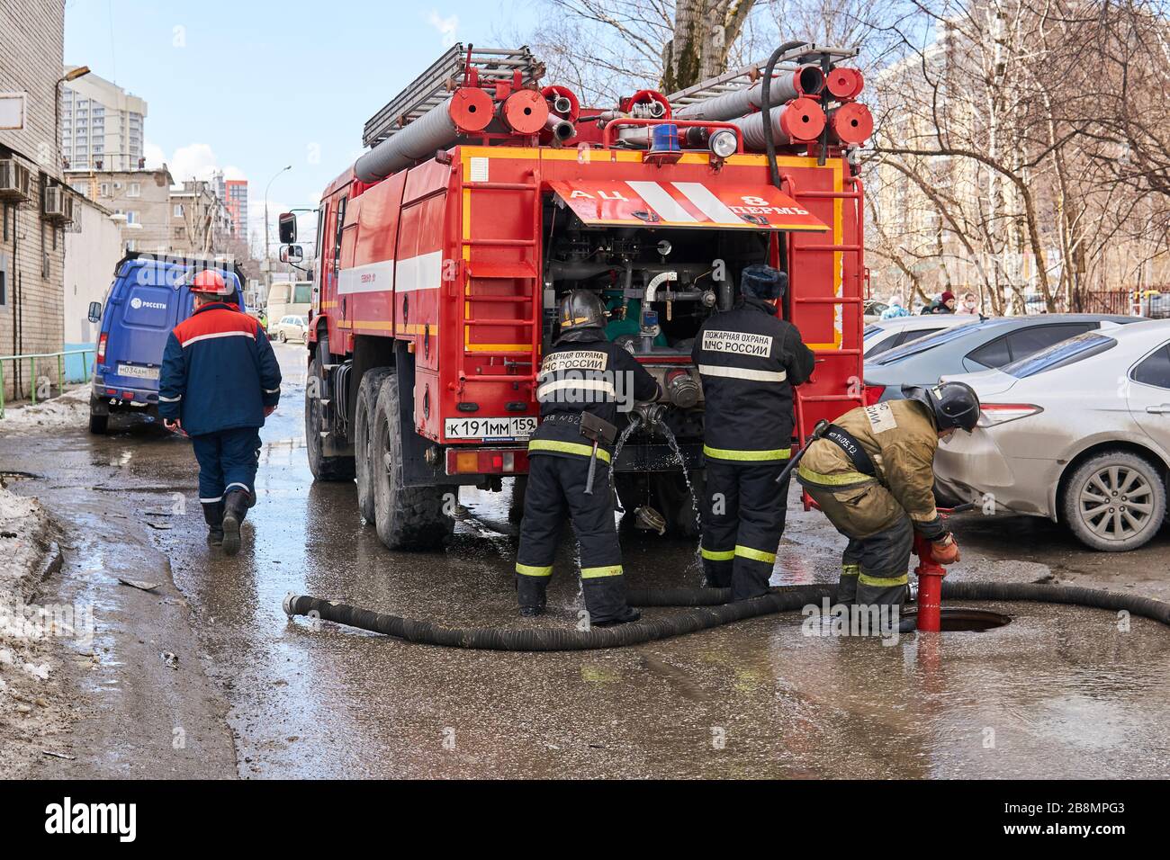 Perm, Russia - March 20, 2020: firefighters use an underground fire ...