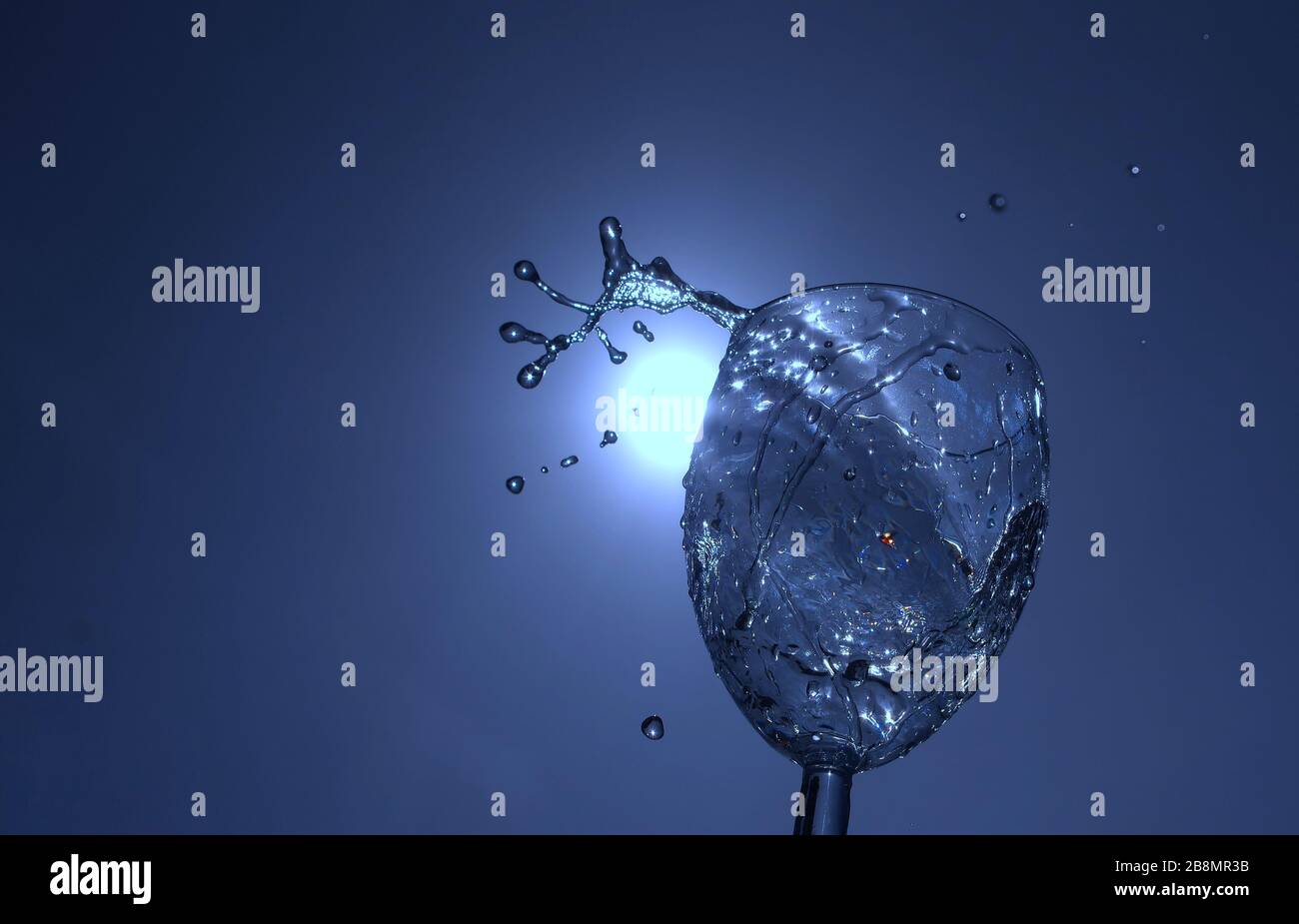 Water splashing from wine glass Stock Photo - Alamy