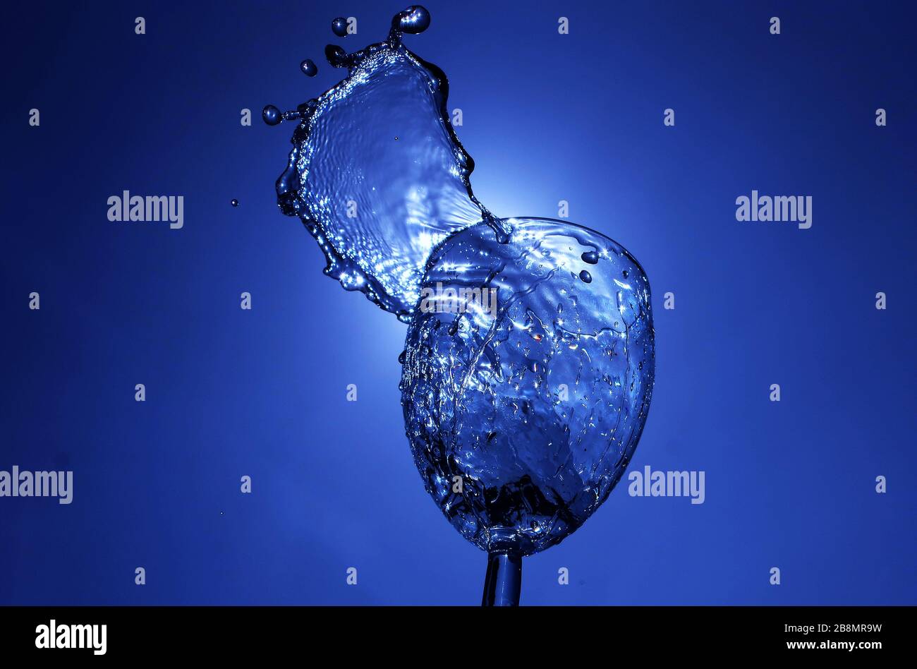 Water splashing from wine glass Stock Photo - Alamy