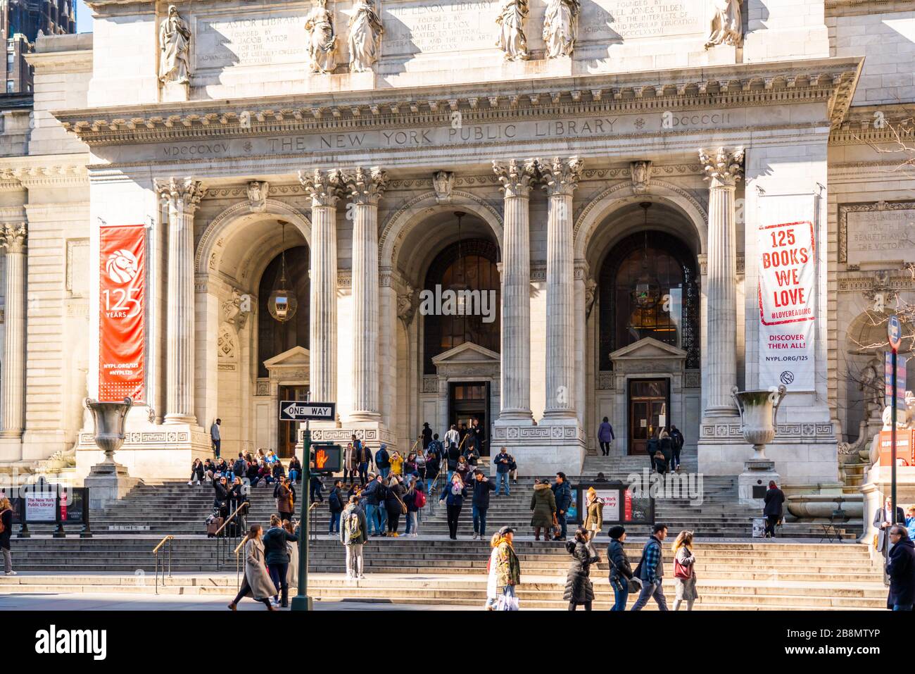 People walk past the New York Public Library in Midtown Manhattan Stock ...