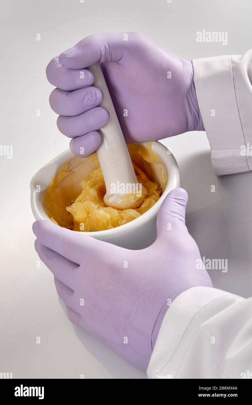 Scientist using pestle hi-res stock photography and images - Alamy