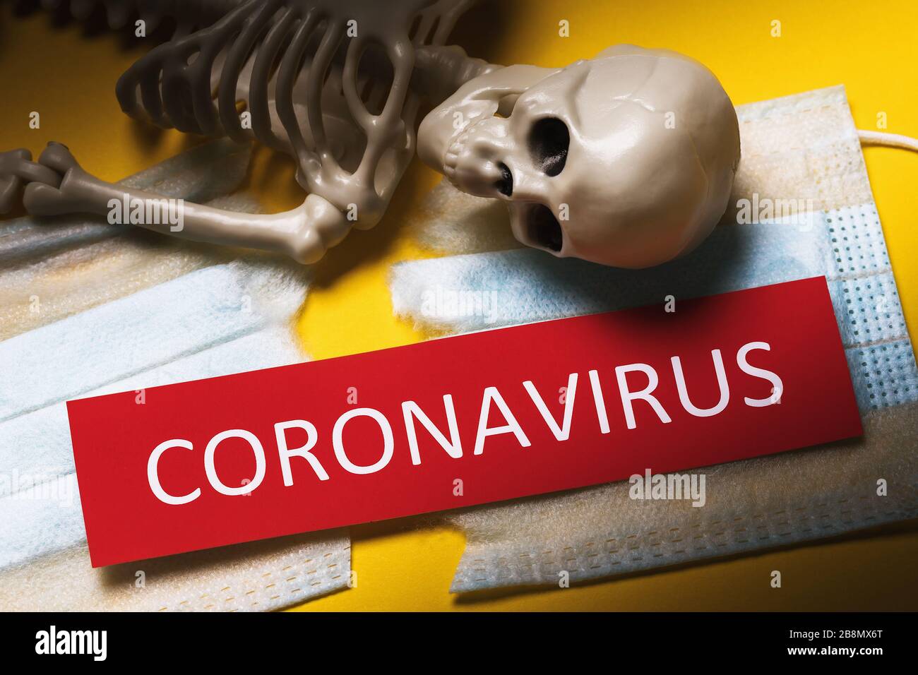 Skeleton, tag with text and torn medical mask. COVID-19 world pandemic ...