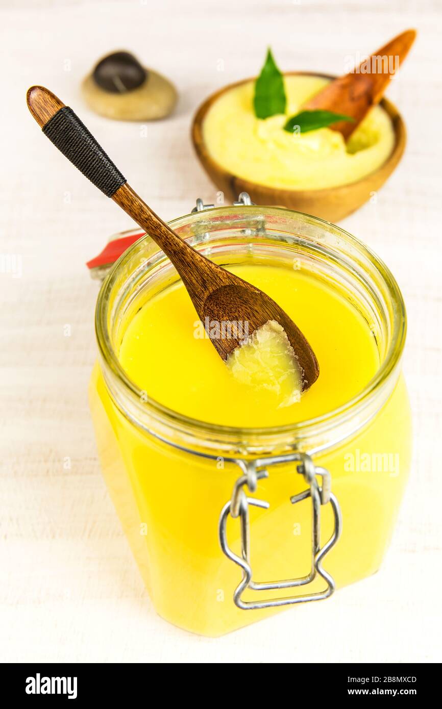 Desi ghee in wooden spoon hi-res stock photography and images - Alamy