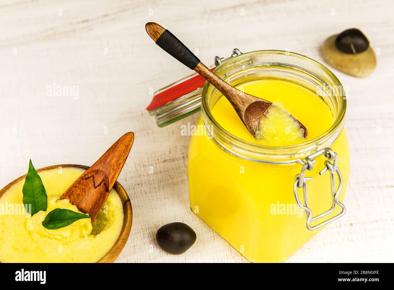 Ghee or clarified butter in jar. Healthy eating and using organic fresh ...